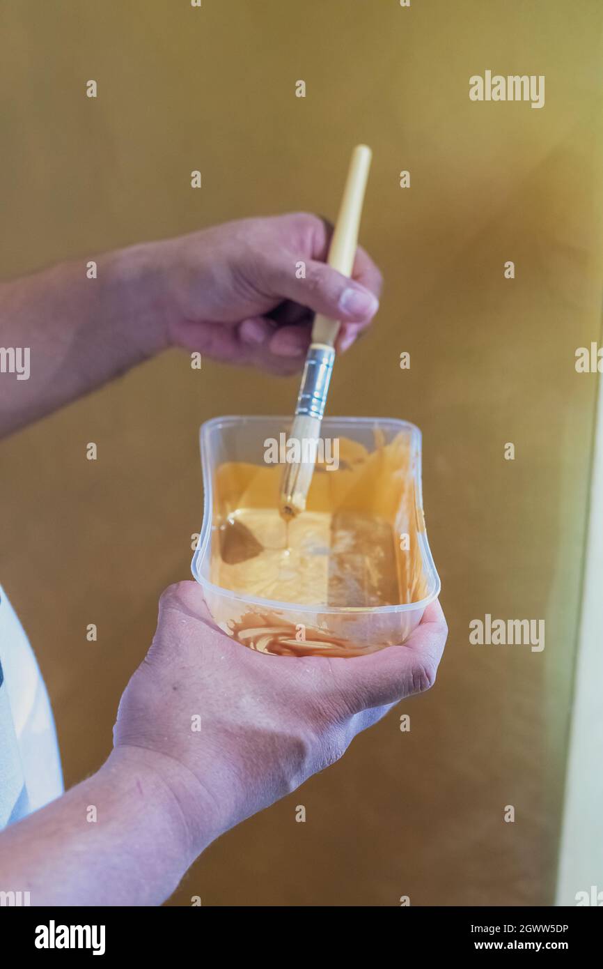 Paintbrush dipping in paint hi-res stock photography and images - Alamy