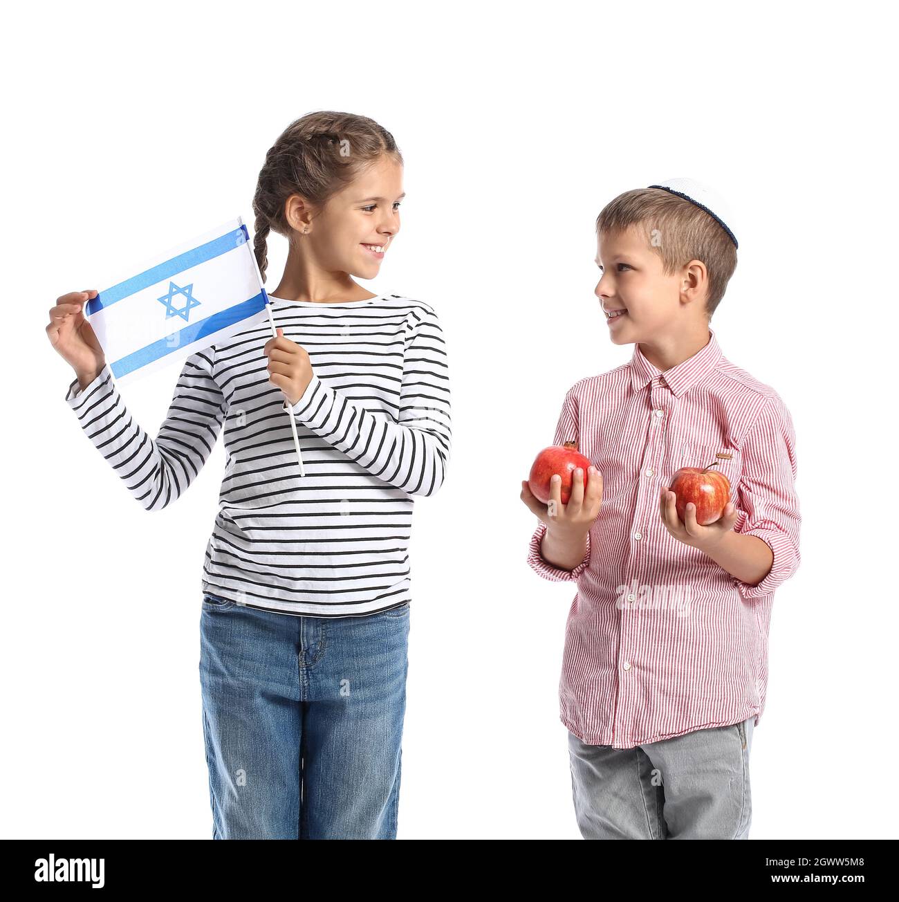 Little children with fruits and flag of Israel on white background ...