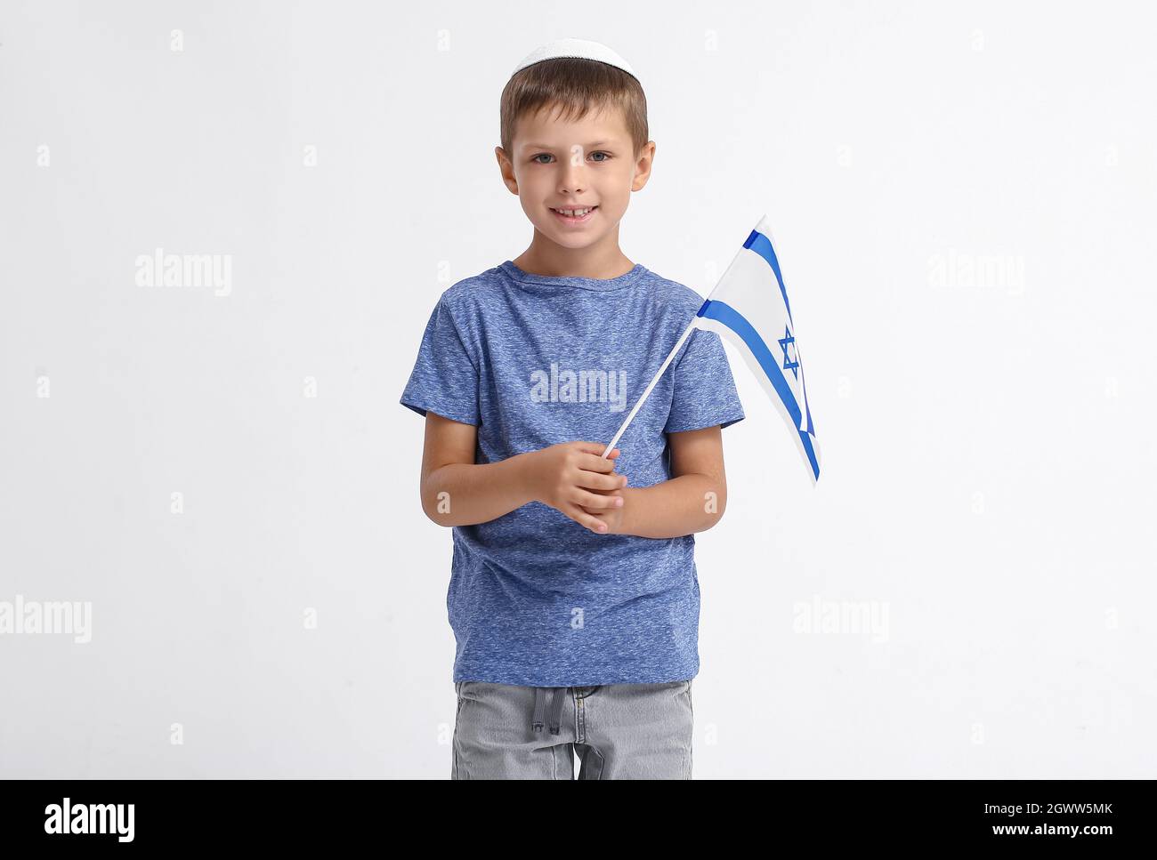 Little boy with the flag of Israel on white background Stock Photo - Alamy