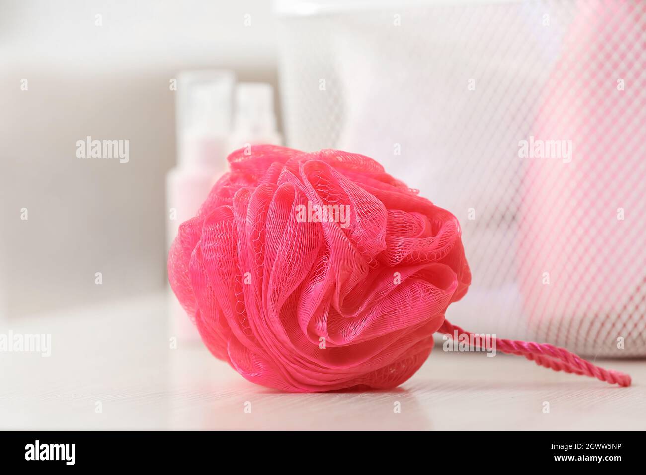 Pink mesh bath and body sponge hi-res stock photography and images - Alamy
