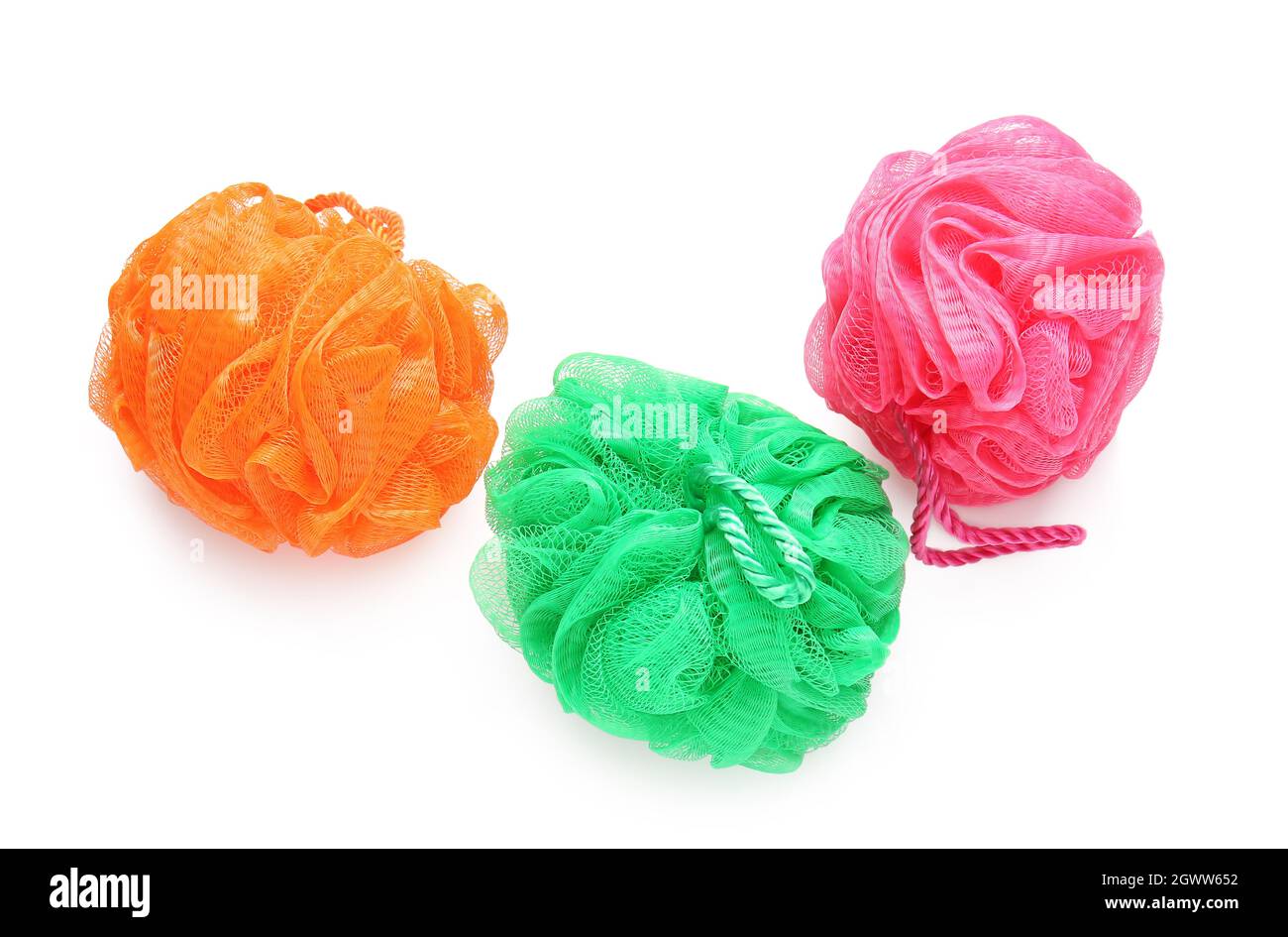 Different bath sponges isolated on white background Stock Photo - Alamy