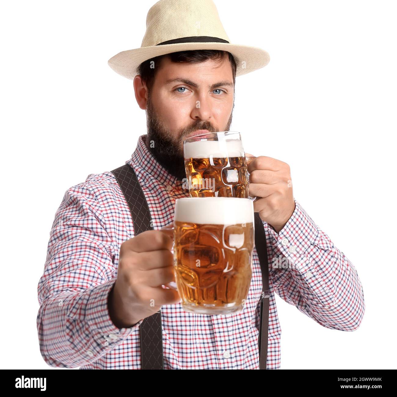 Handsome man in traditional German clothes and with beer on white ...