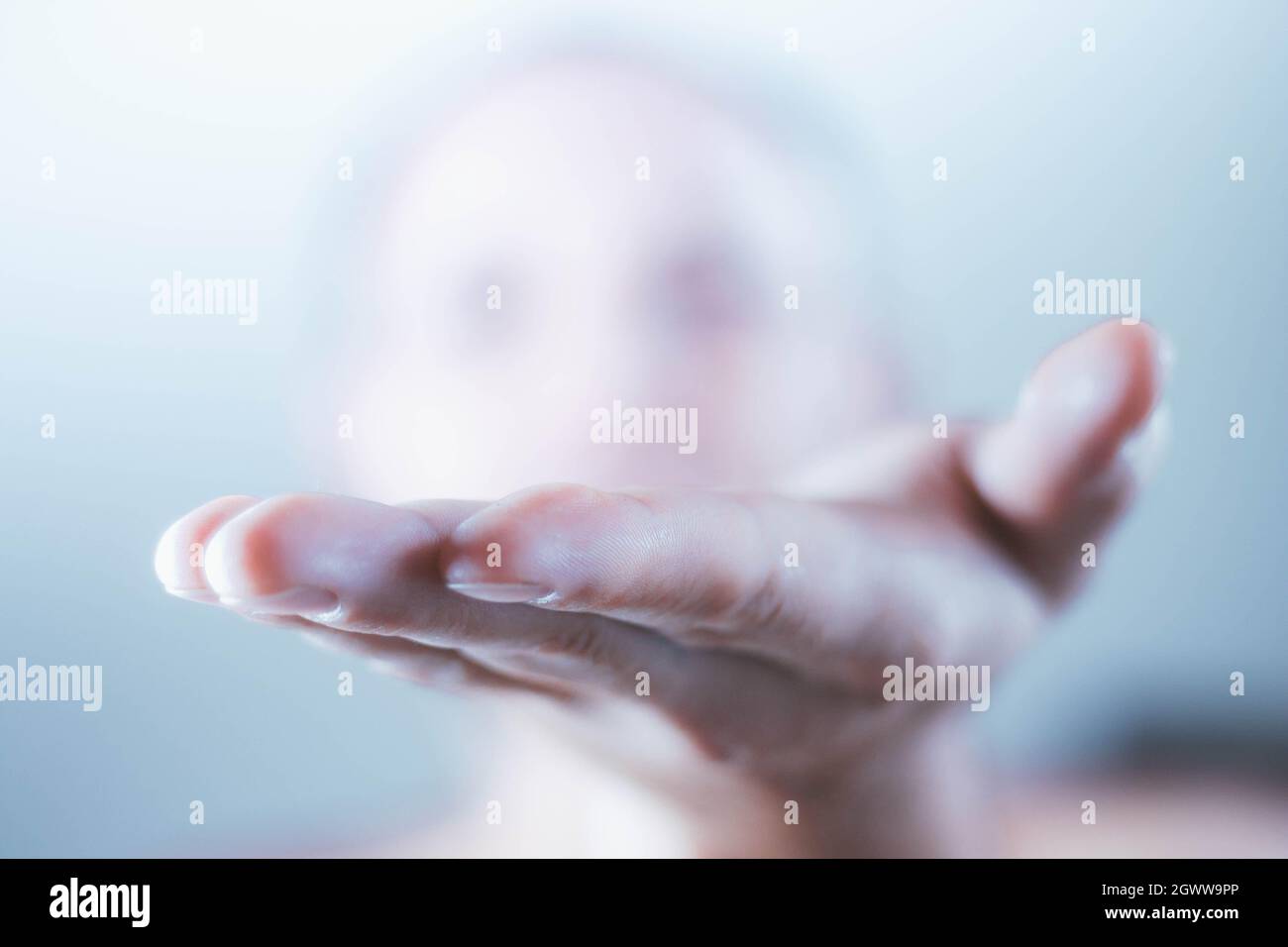 Empty space above the palm of a person. Hand, palm up Stock Photo - Alamy