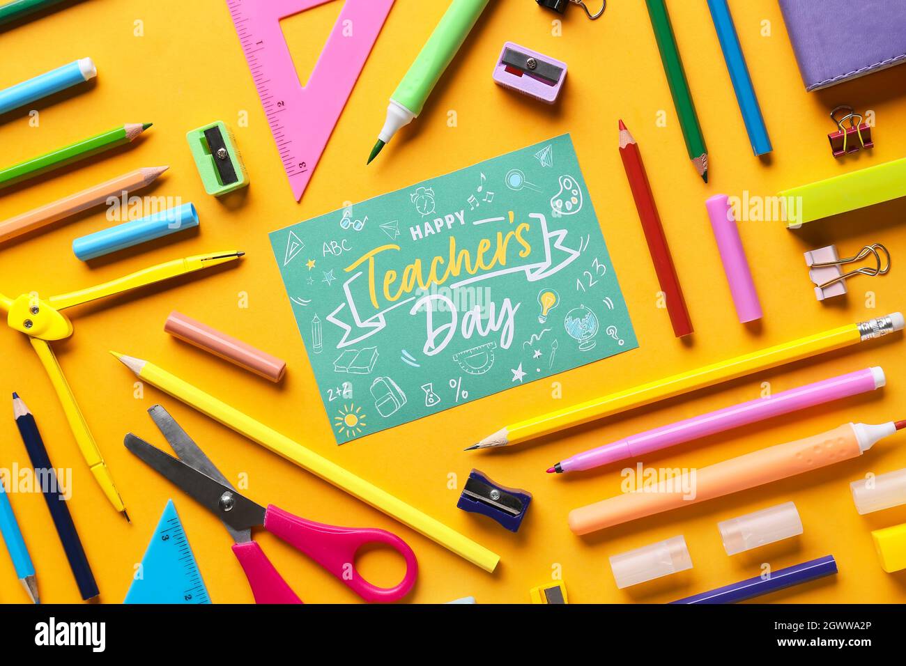 Concept of Teacher's Day. School supplies and greeting card on color ...