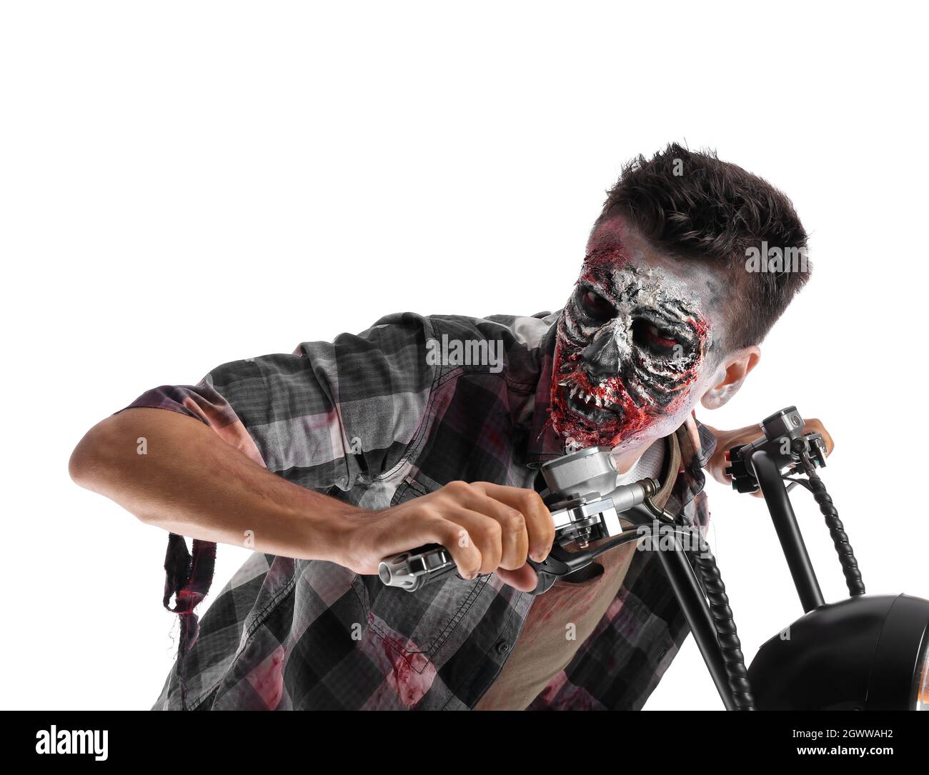 Man dressed for Halloween as zombie with motorcycle on white background ...