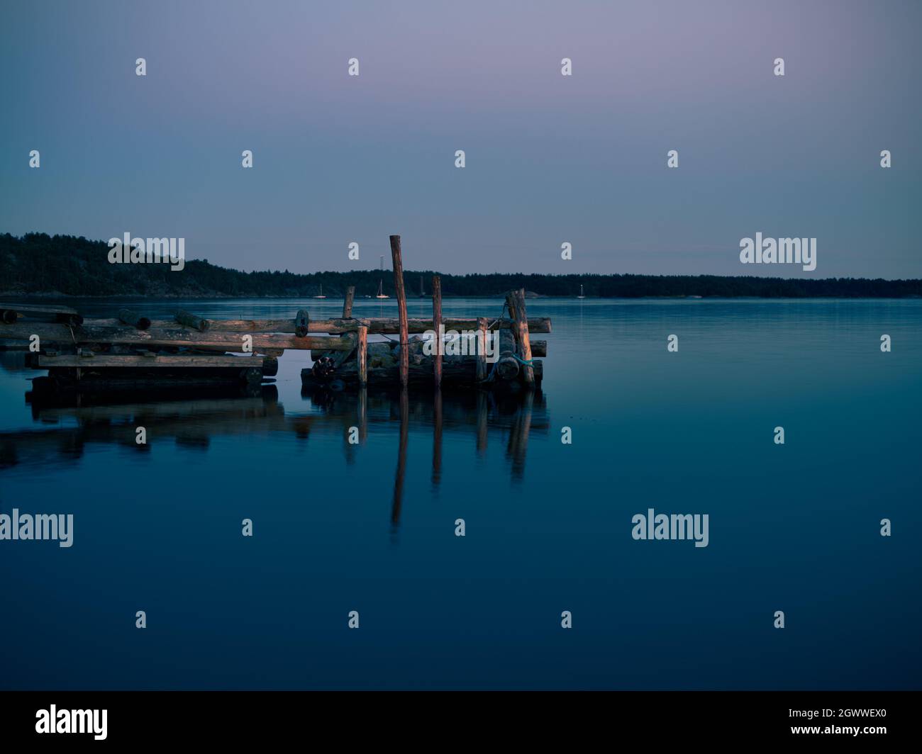 A Old Broken Jetty By The Lake At Night Stock Photo - Alamy