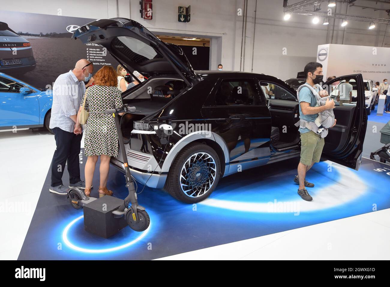 People observe the Hyundai IONIOS electric car at the Automobile ...
