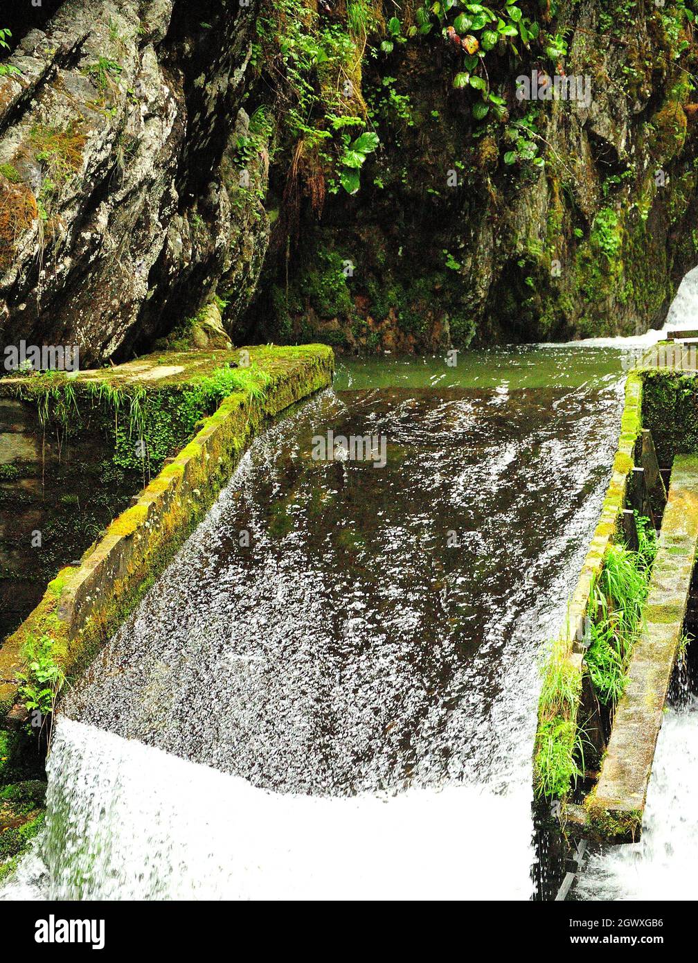 An artificially constructed gutter in the bed of a turbulent mountain ...
