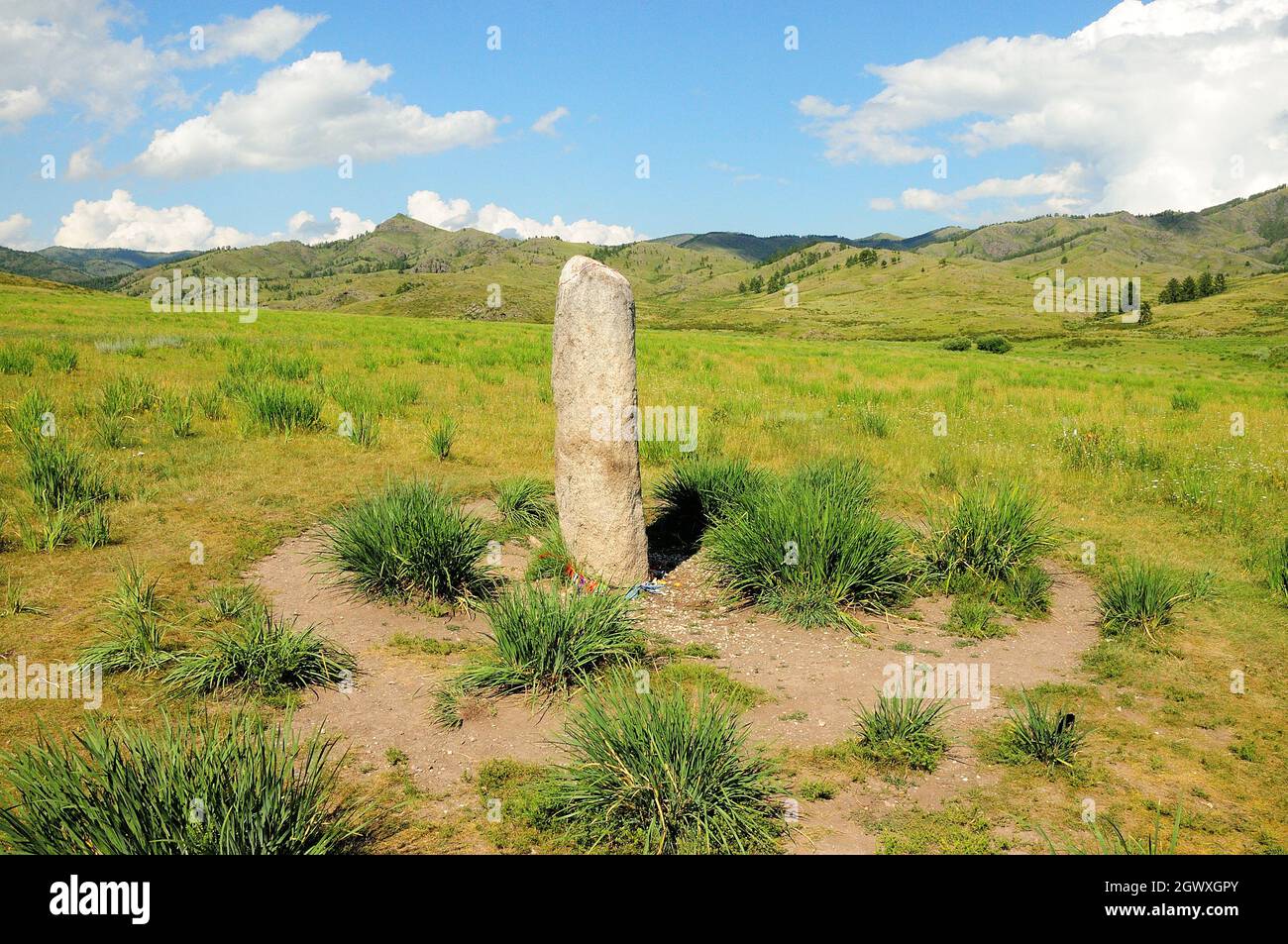A ritual granite monolith in the center of a picturesque valley ...