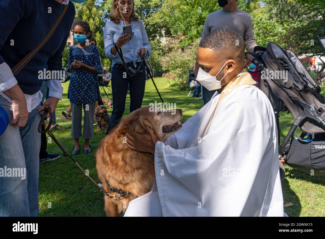 NEW YORK, NY - OCTOBER 03: A priest blesses a dog at the Blessing of ...