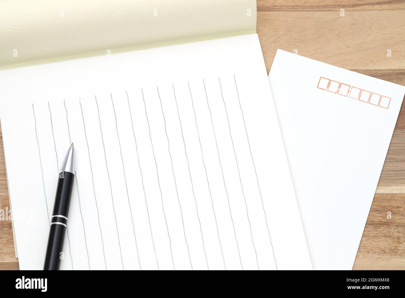 Japanese writing letter paper with ballpoint pen on wooden background ...