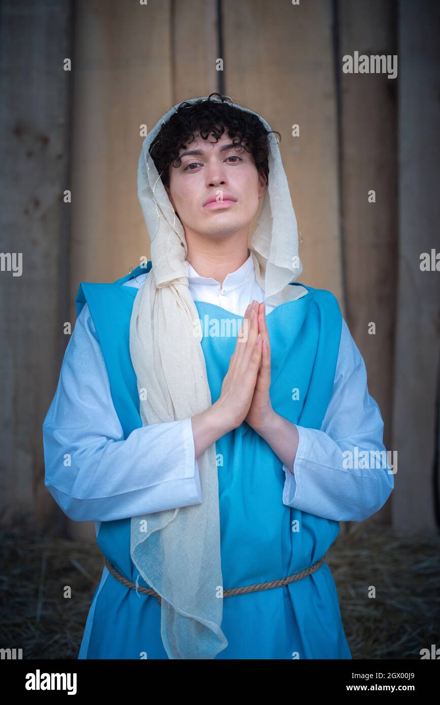 Portrait of an androgynous virgin mary praying Stock Photo - Alamy