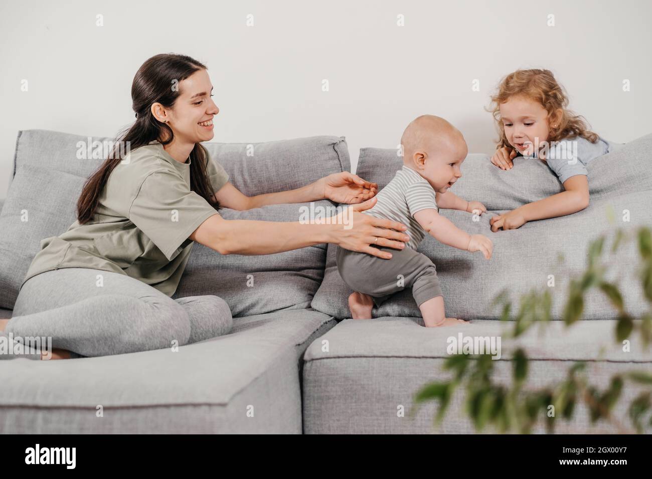 Brother sister cuddling hi-res stock photography and images - Alamy