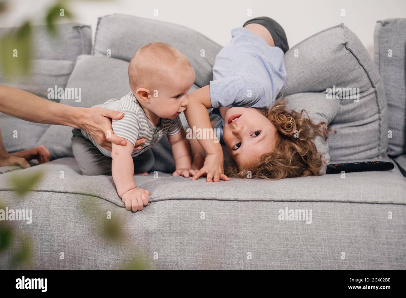 Brother sister cuddling hi-res stock photography and images - Alamy