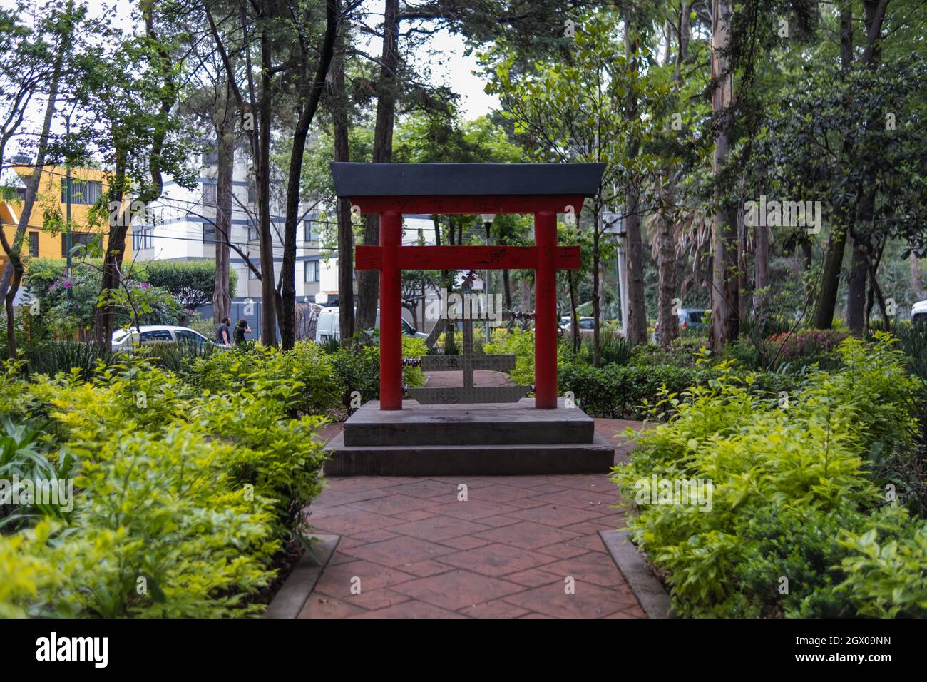 Traditional Japanese gate and symbol surrounded by trees in park Stock ...