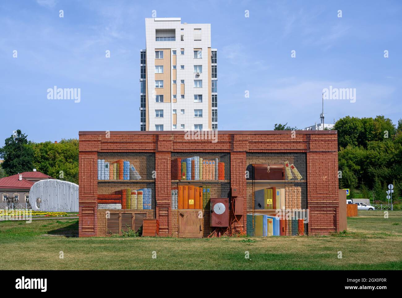 Brick technological booth decorated with the graffity image of a ...