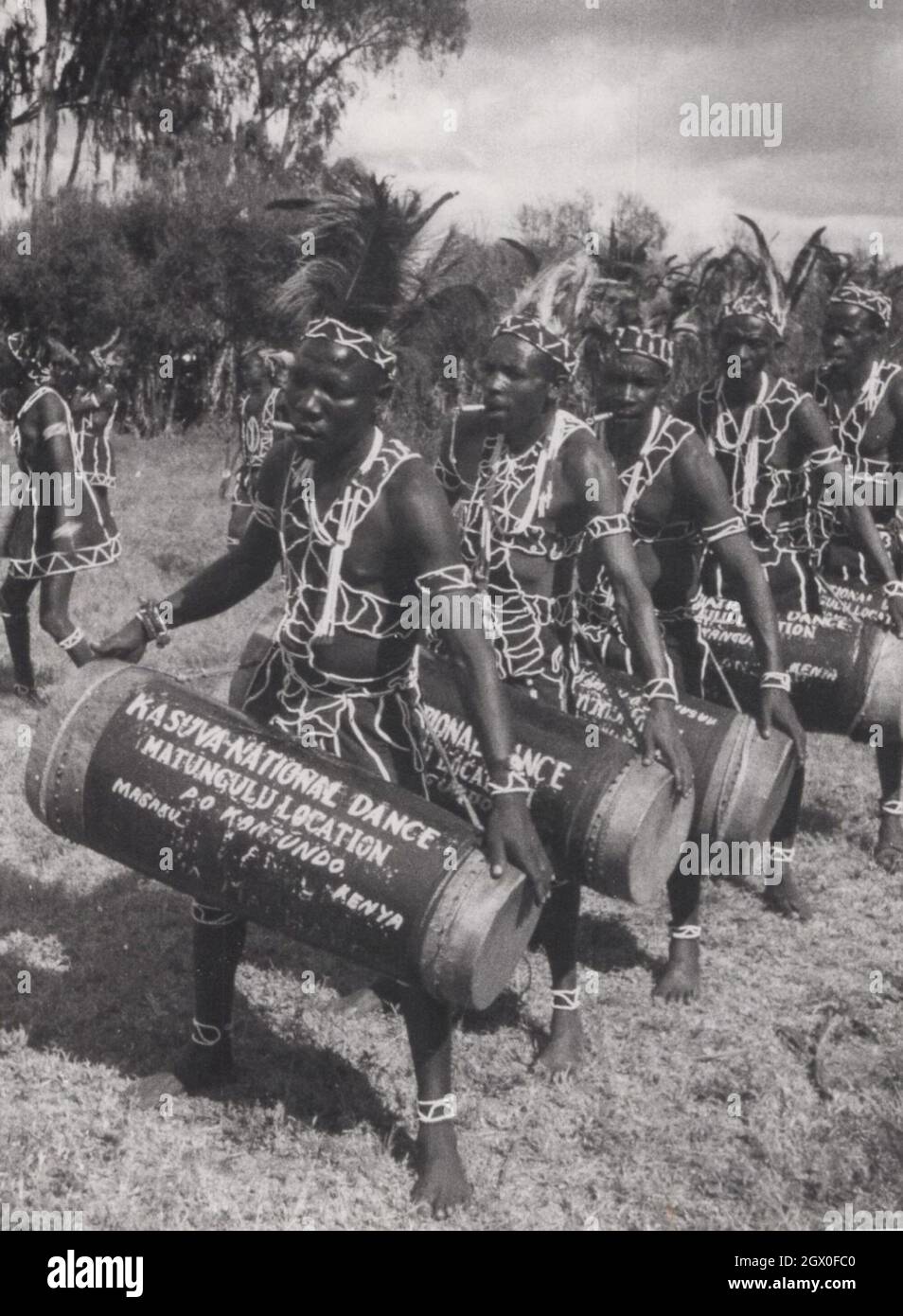 rarely seen photograph: A group of tribe man are dancing a traditional ...