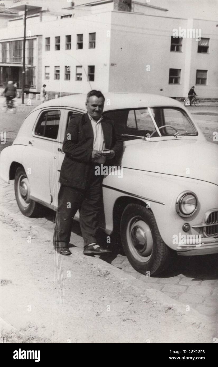 retro monochrome photo about a proud man / male who is posing with his ...