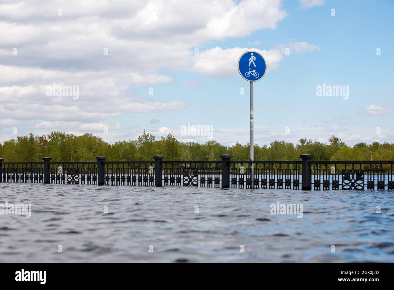 A Picturesque View Of The River Embankment Flooded With Water Stock ...