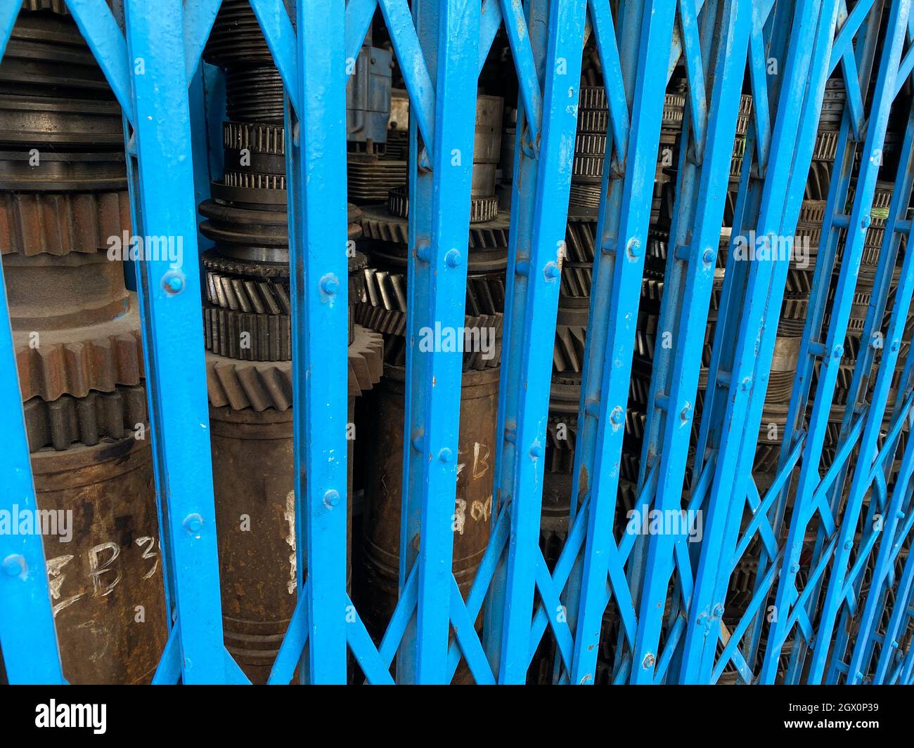 Close-up Of Blue Metallic Sliding Gate Structure Against Building Stock ...