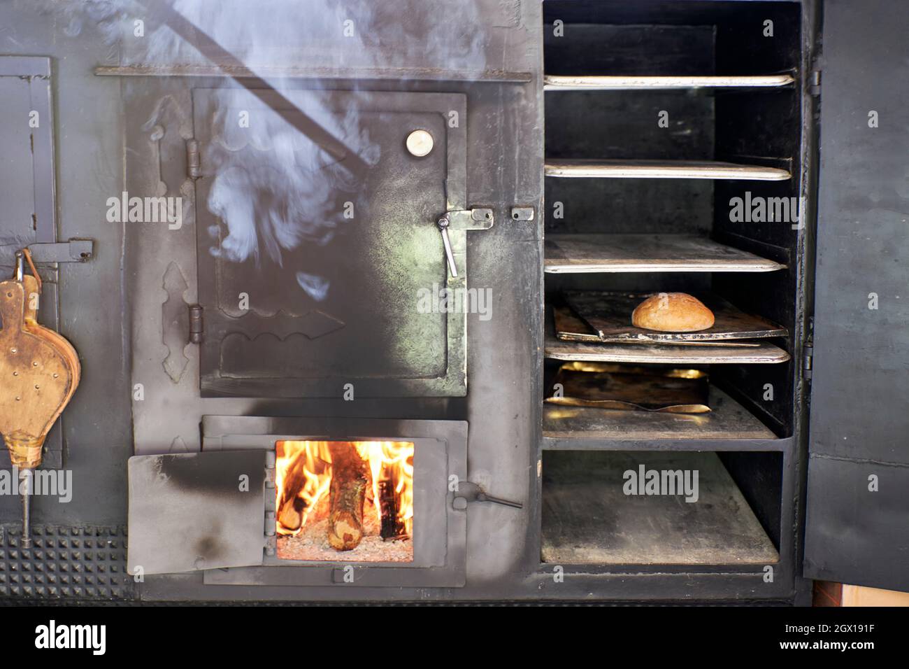 Smoking wood burning stove hi-res stock photography and images - Alamy