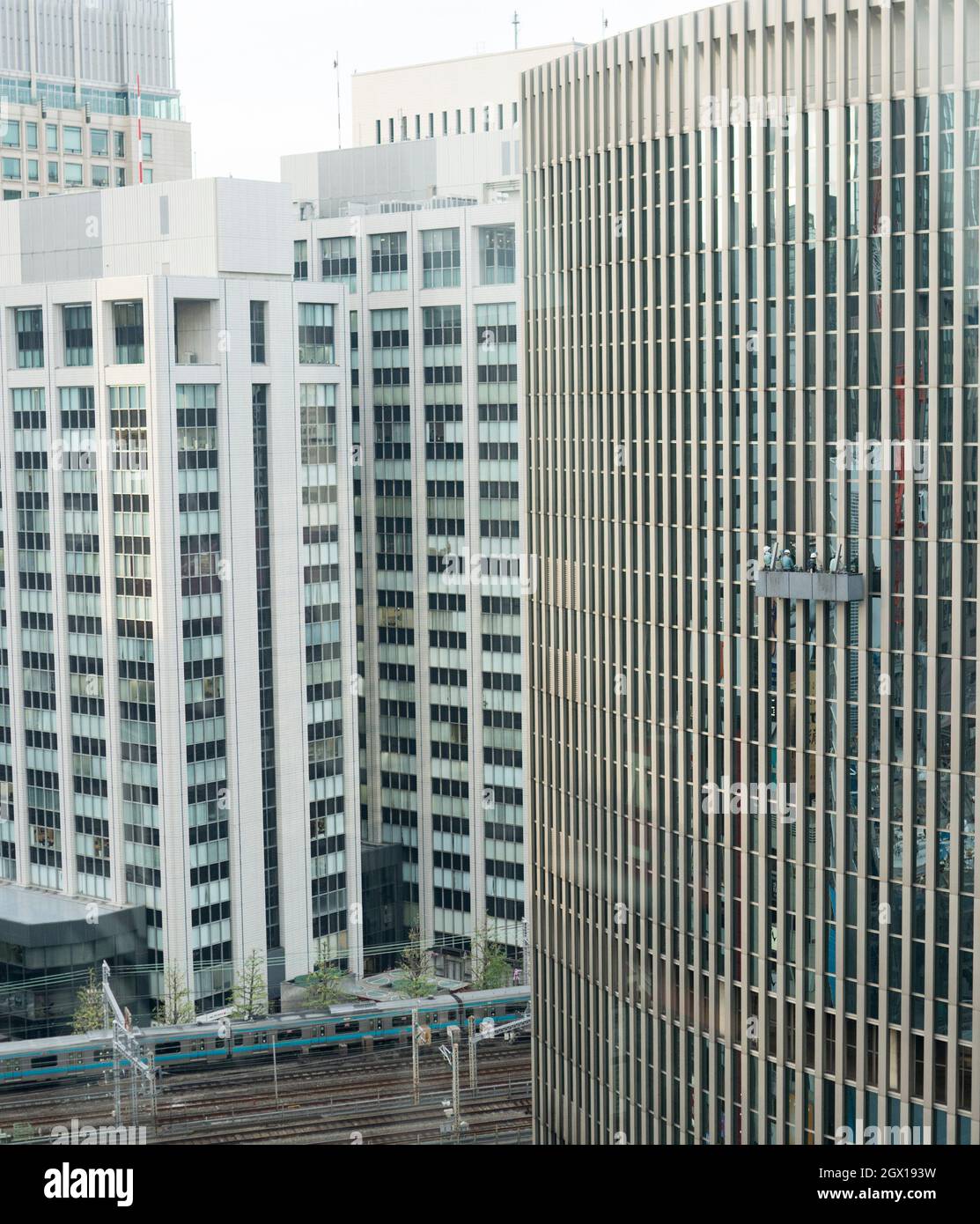 Modern Office Buildings In The City Of Tokyo With Window Cleaners Stock ...