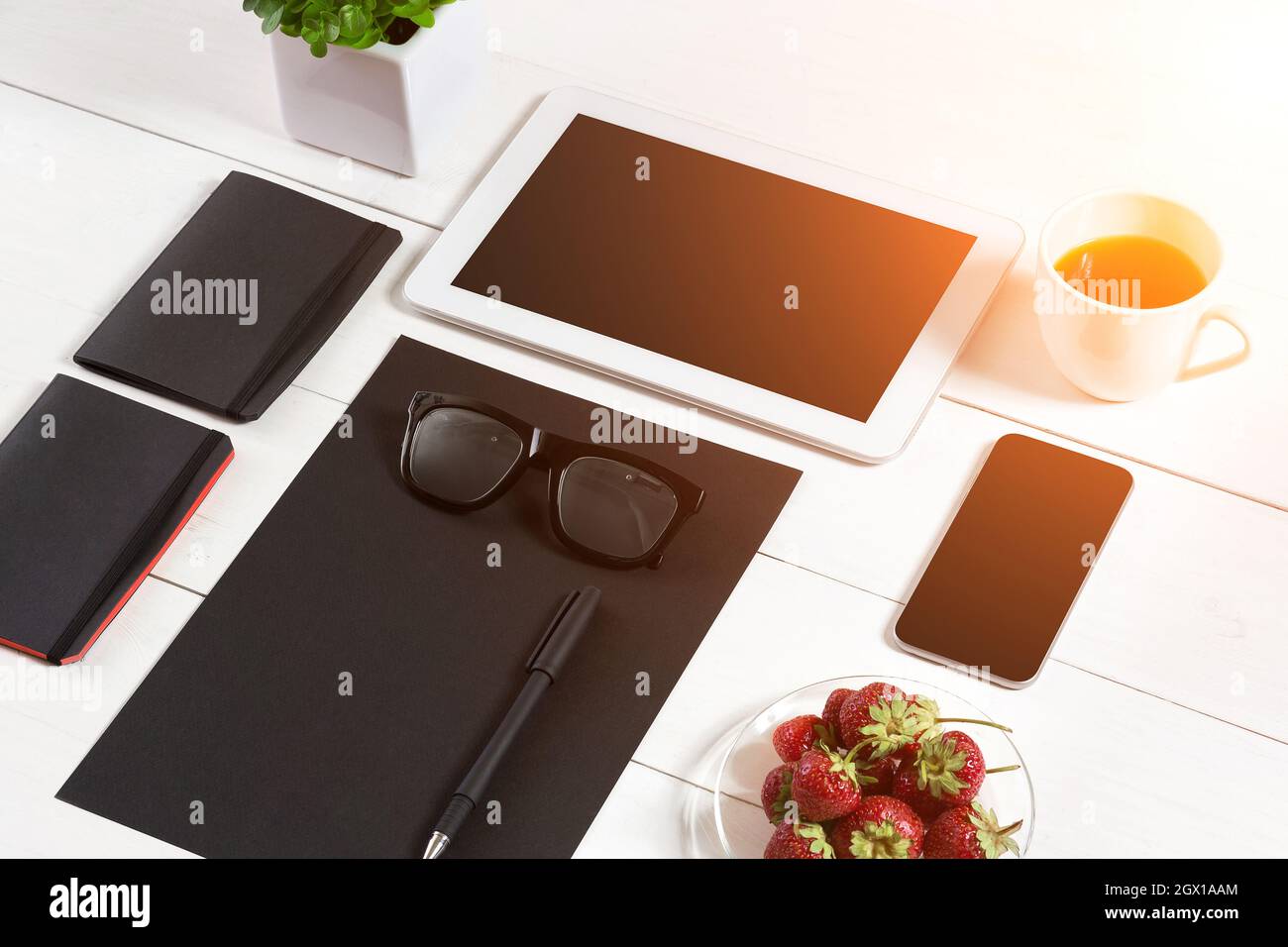 Modern workplace with digital tablet computer and mobile phone, cup of ...