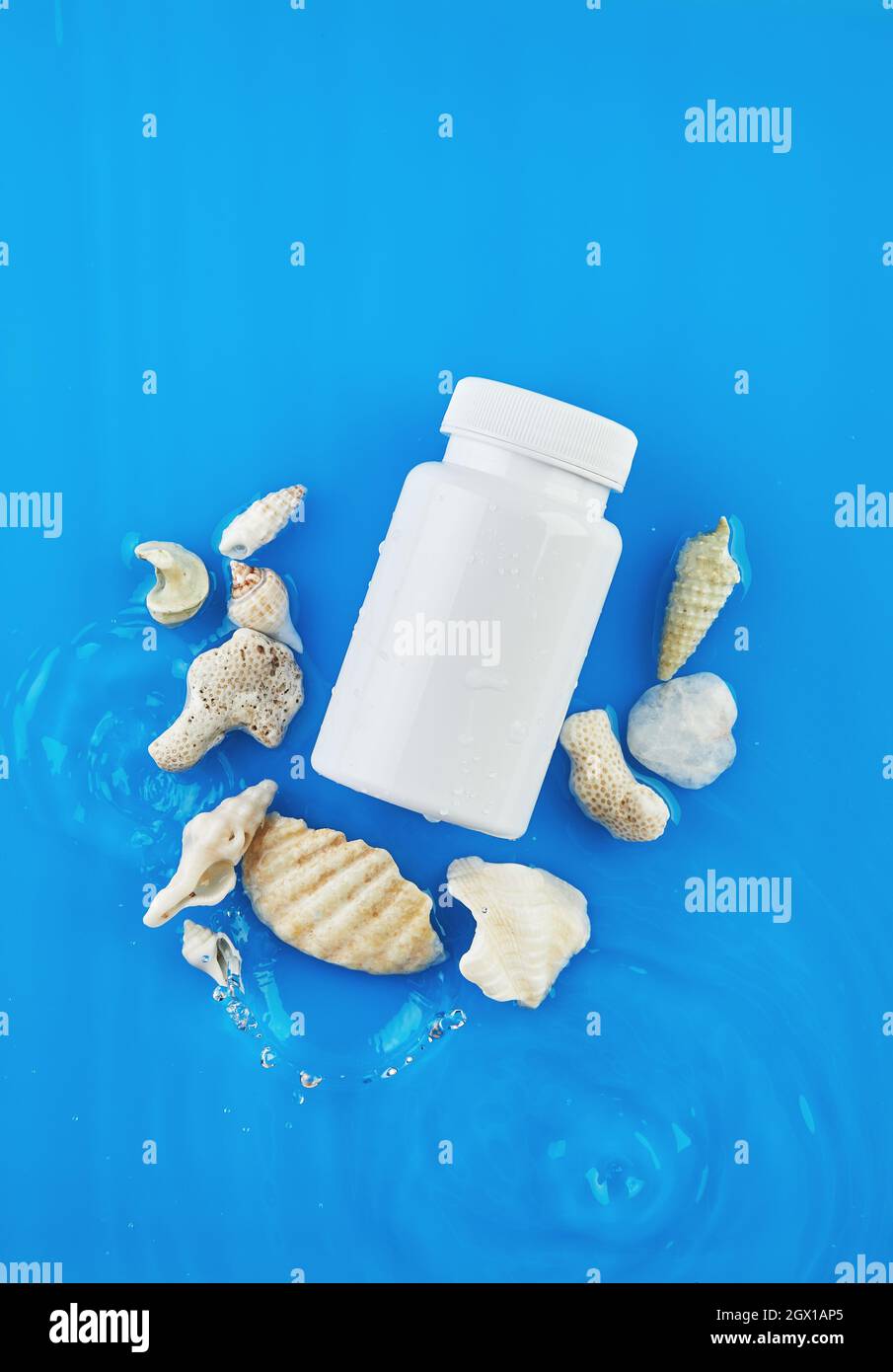 Jar mockup on blue background in water with waves and seashells Stock ...