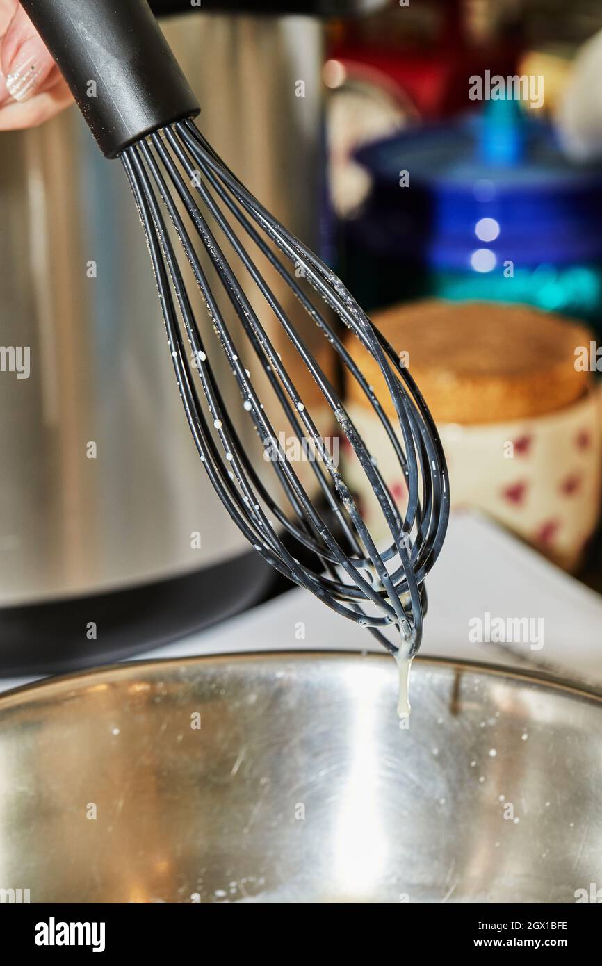 Drop flowing down from the whisk after making the dough Stock Photo - Alamy