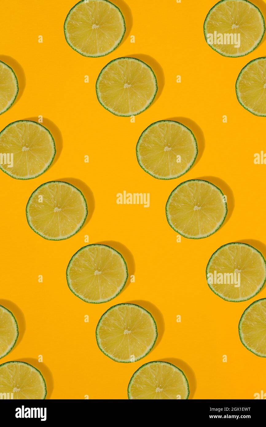 Lime pattern on yellow background. Minimal flat lay concept Stock Photo ...