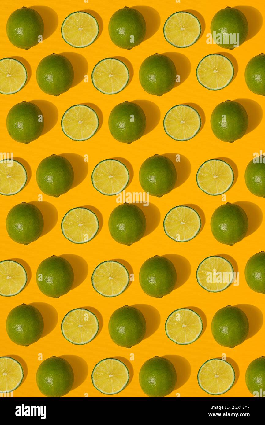 Lime pattern on yellow background. Minimal flat lay concept Stock Photo ...