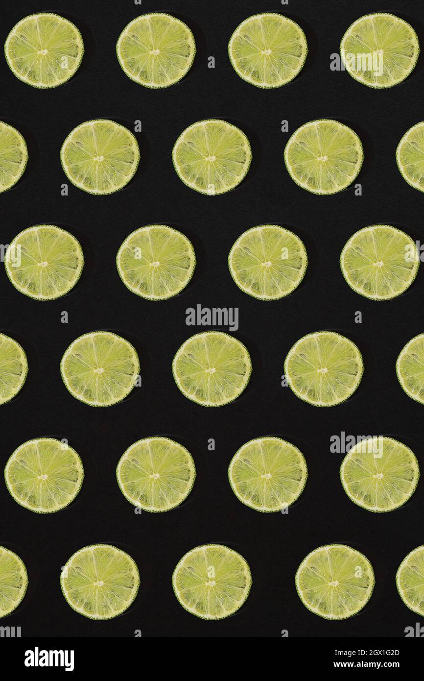 Lime pattern on black background. Minimal flat lay concept Stock Photo ...