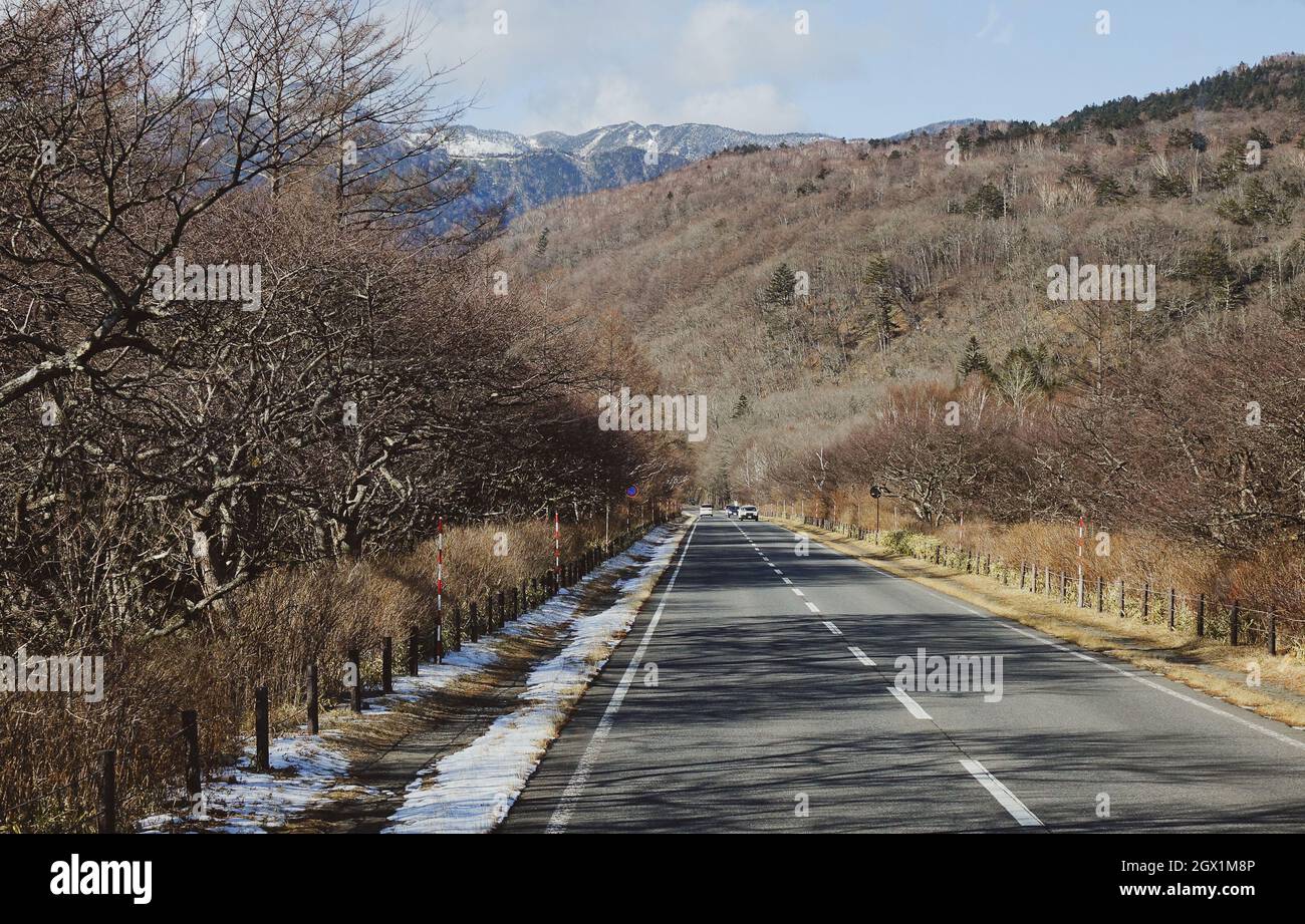 Mountain road at autumn in Nikko, Japan. Nikko offers beautiful scenery ...