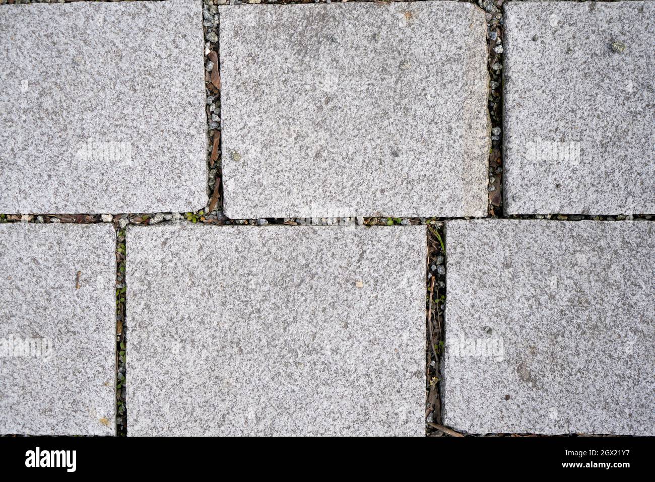 Top view of a walking path with gray square concrete tiles texture ...