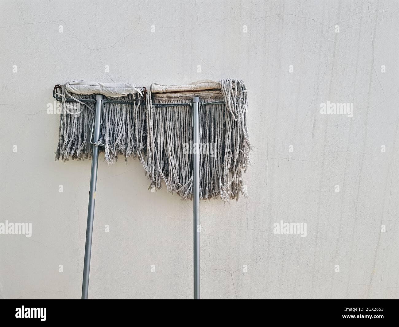 Old cleaning mops hi-res stock photography and images - Alamy