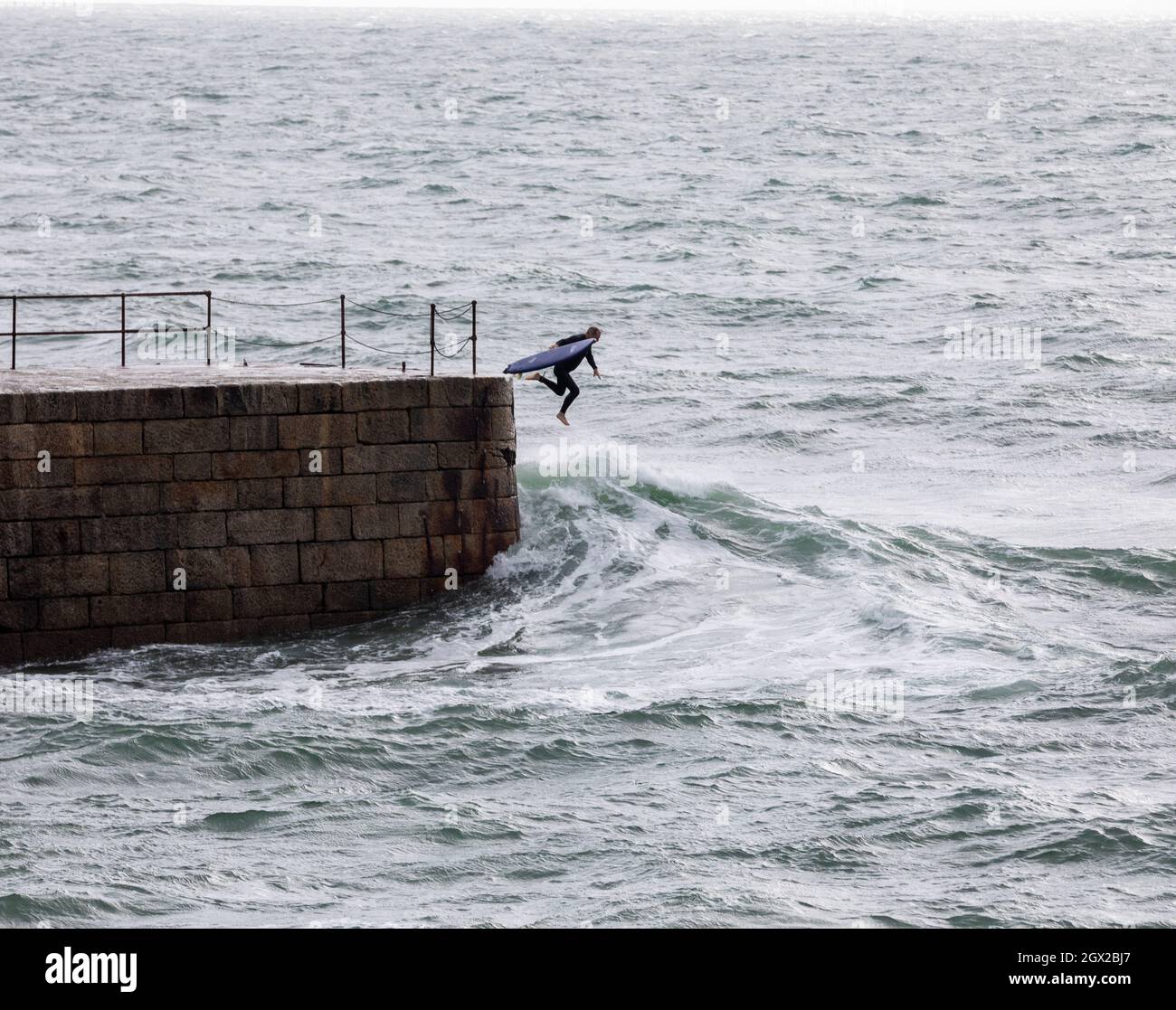 Jumping off harbour wall hi-res stock photography and images - Alamy