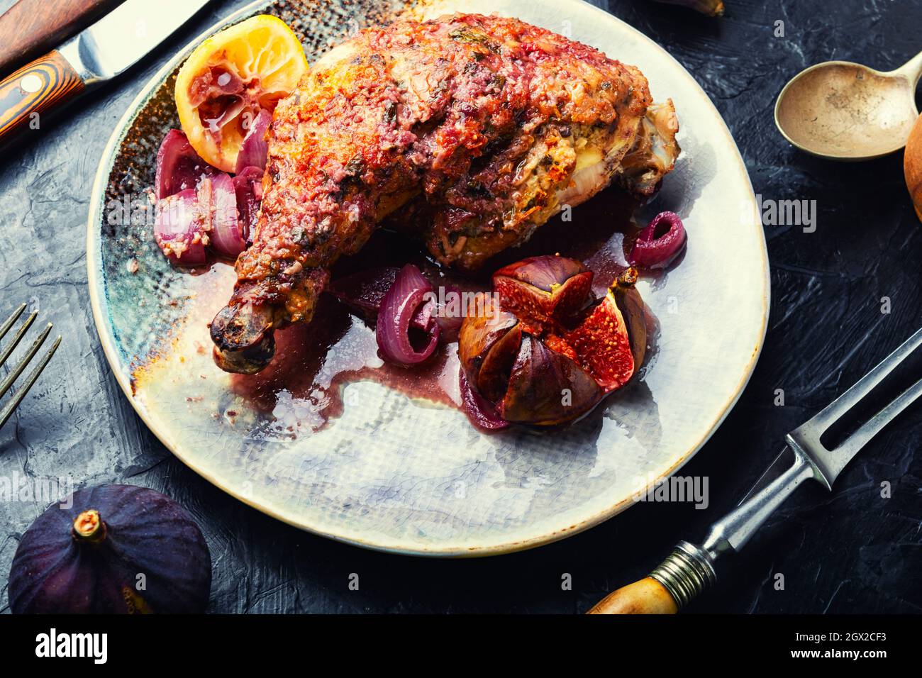 Chicken meat fried in fig fruit. Dinner meat with figs sauce Stock ...