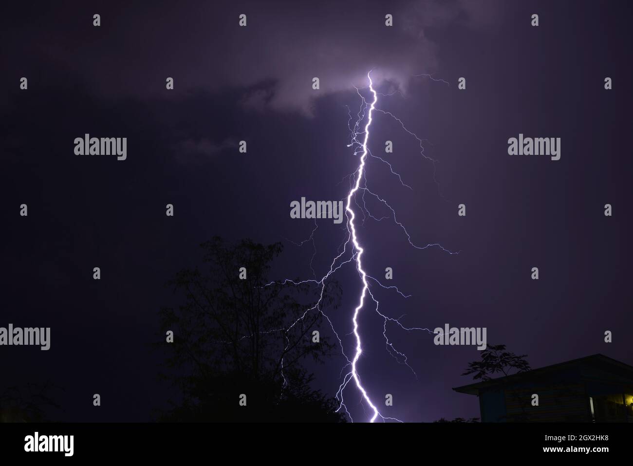 Lightning Strike Over Homes During A Summer Thunderstorm Stock Photo ...