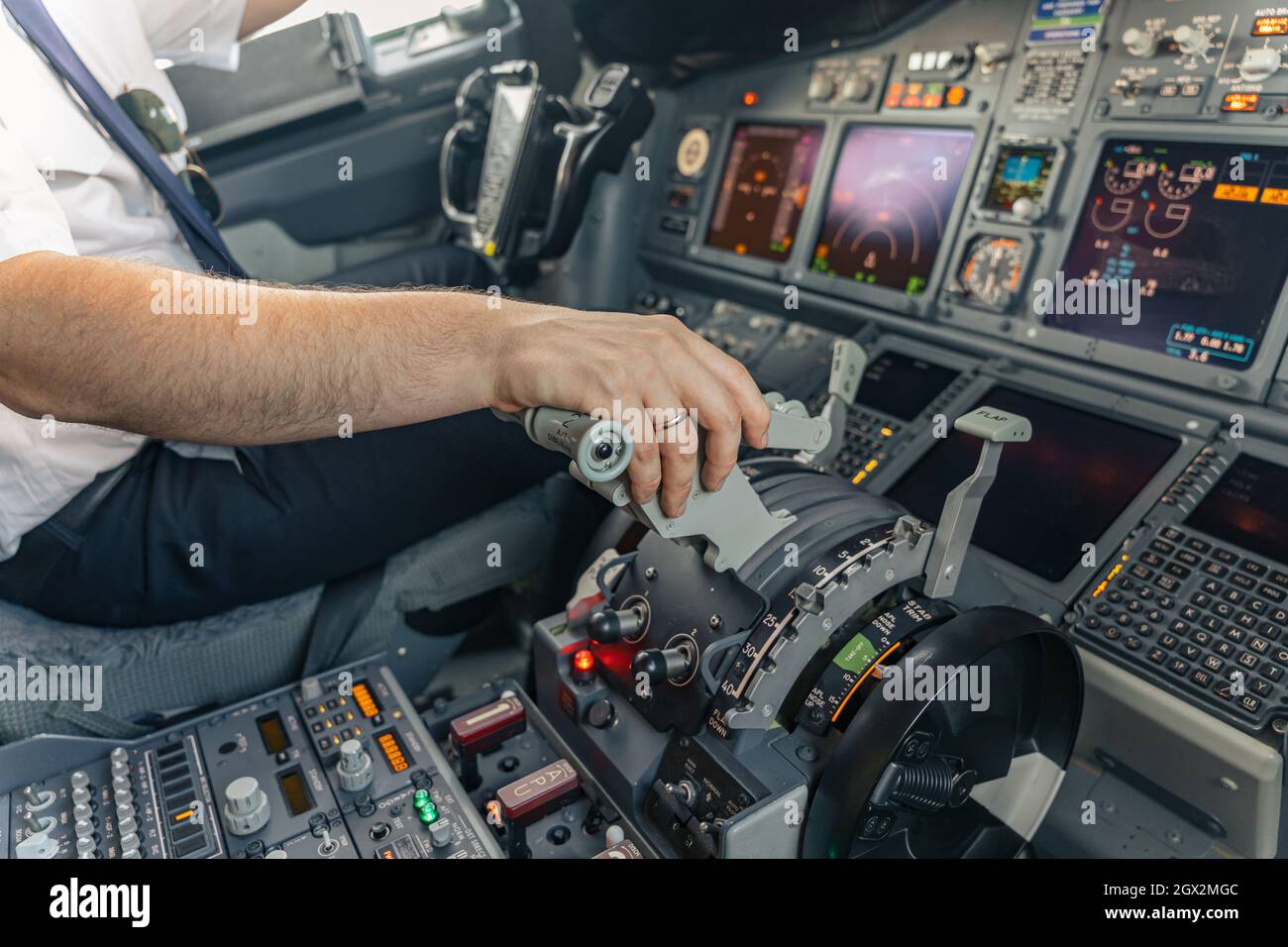 Pilot is piloting airplane from airplane cockpit Stock Photo - Alamy