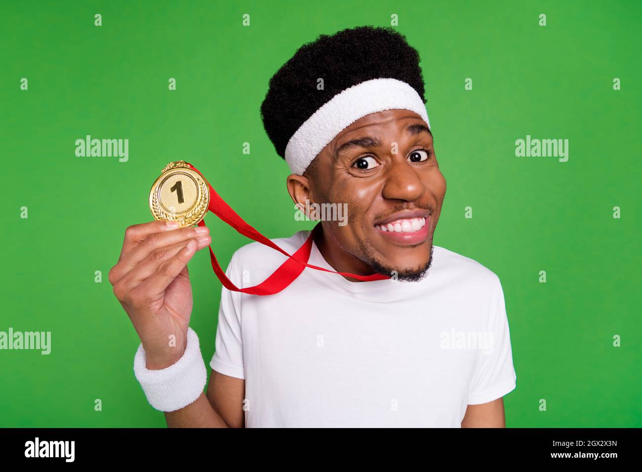 Portrait of trendy attractive cheerful lucky guy sportsman holding ...