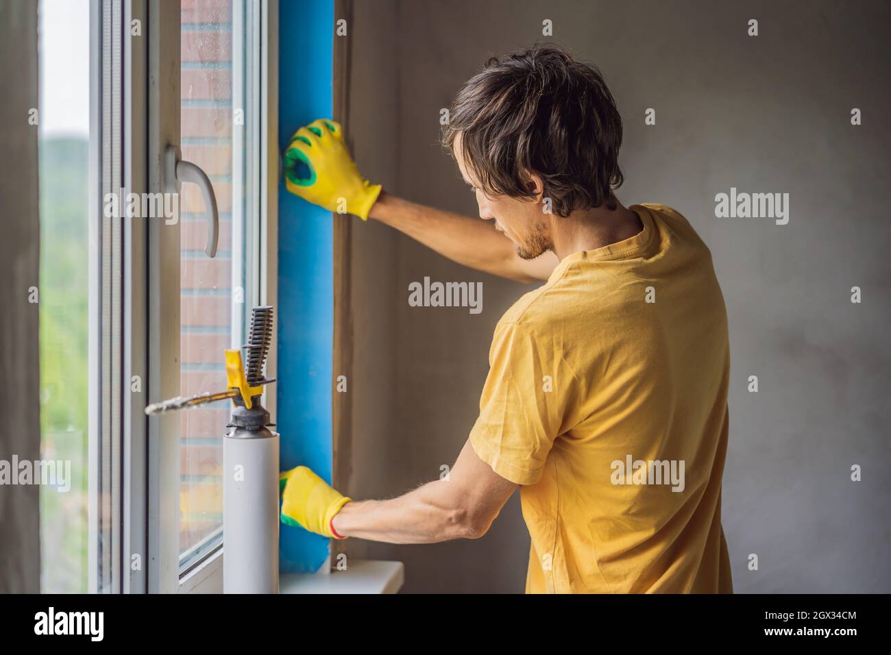 Builder or handyman is engaged in the repair or installation of windows ...