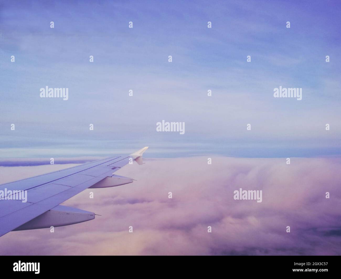 Airplane flying over pink clouds hi-res stock photography and images ...