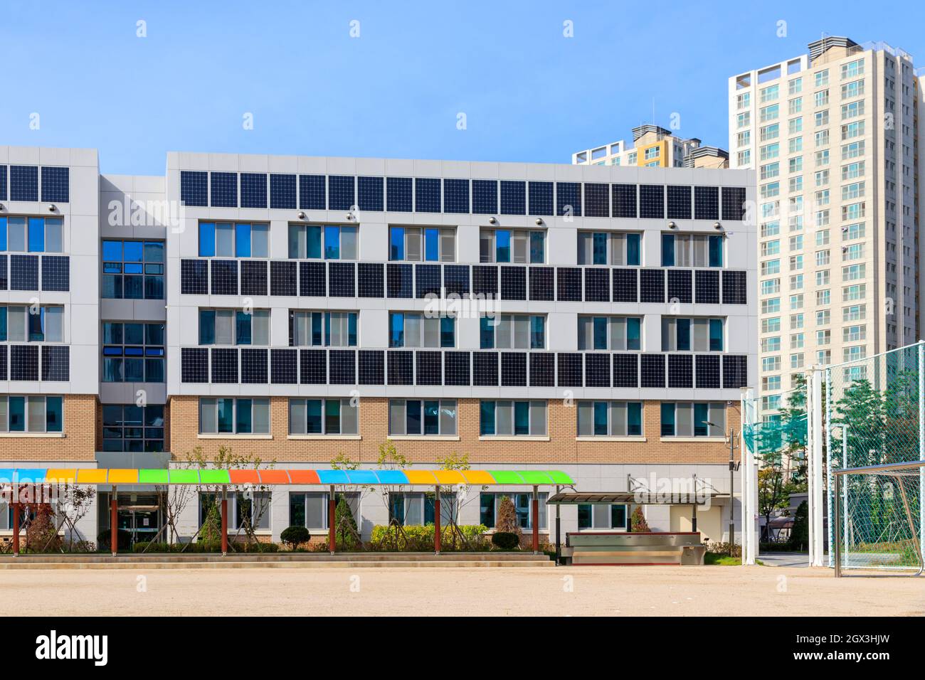 Building solar panels. Solar elementary school building. Eco-friendly ...