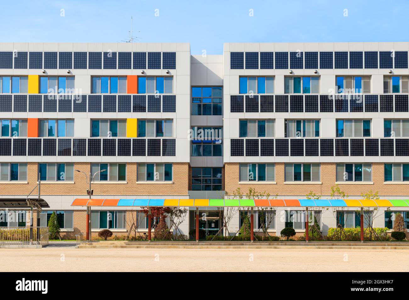 Building solar panels. Solar elementary school building. Eco-friendly ...