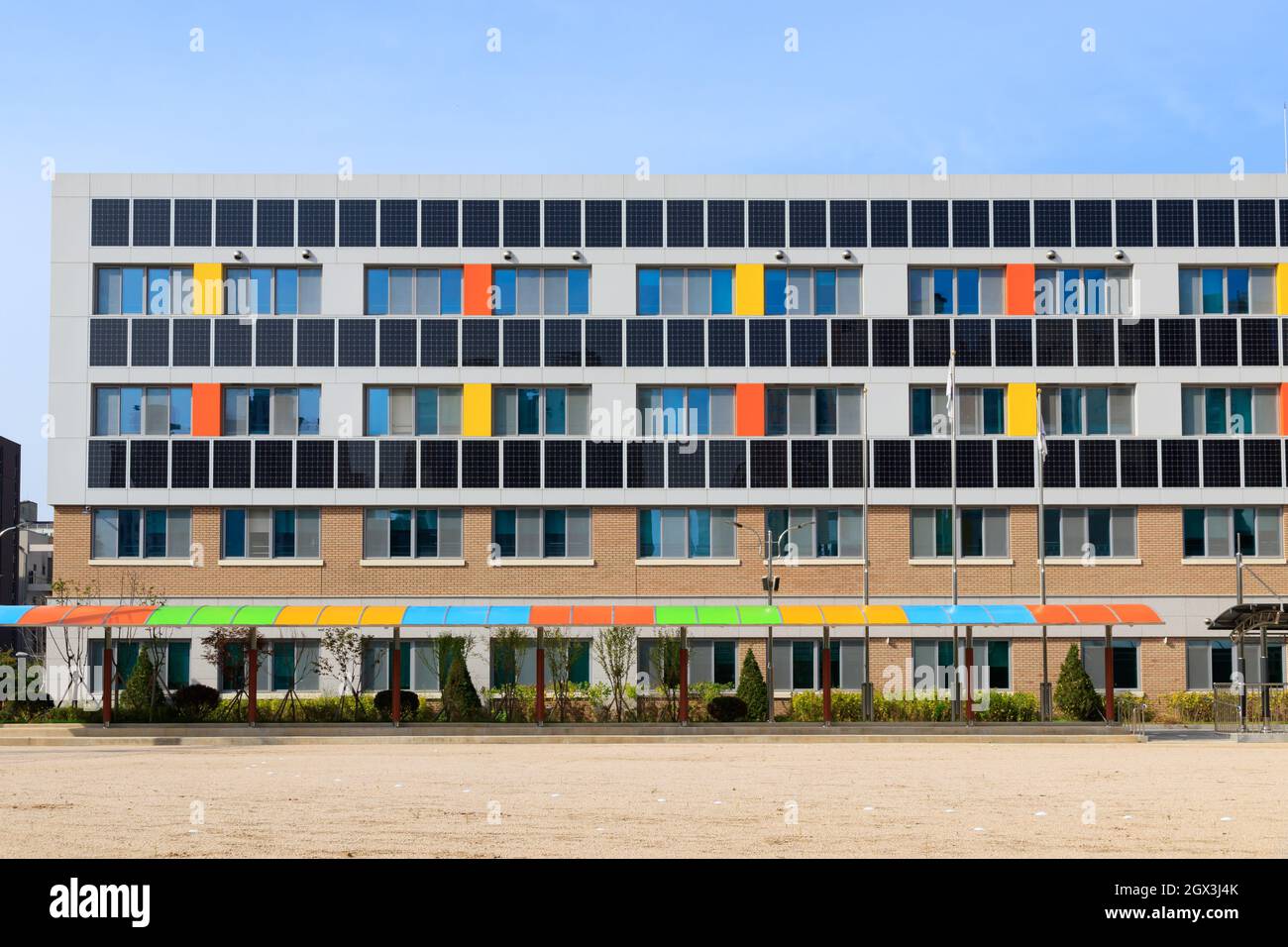 Building solar panels. Solar elementary school building. Eco-friendly ...