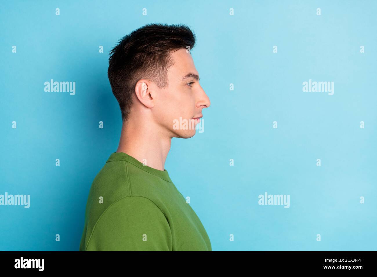 Profile photo of confident focused guy look empty space wear green ...