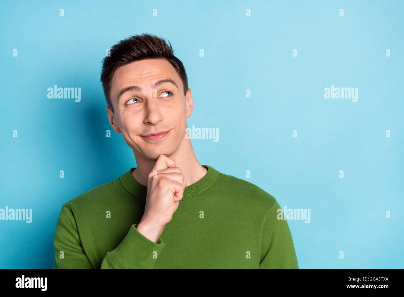 Photo of smart intelligent man look empty space create plan wear green ...