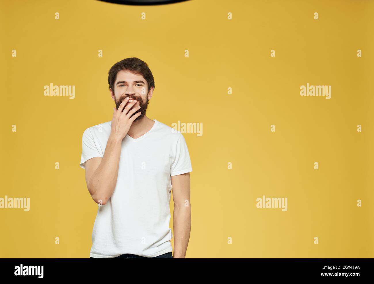 emotional man in a white t-shirt irritated facial expression close-up ...