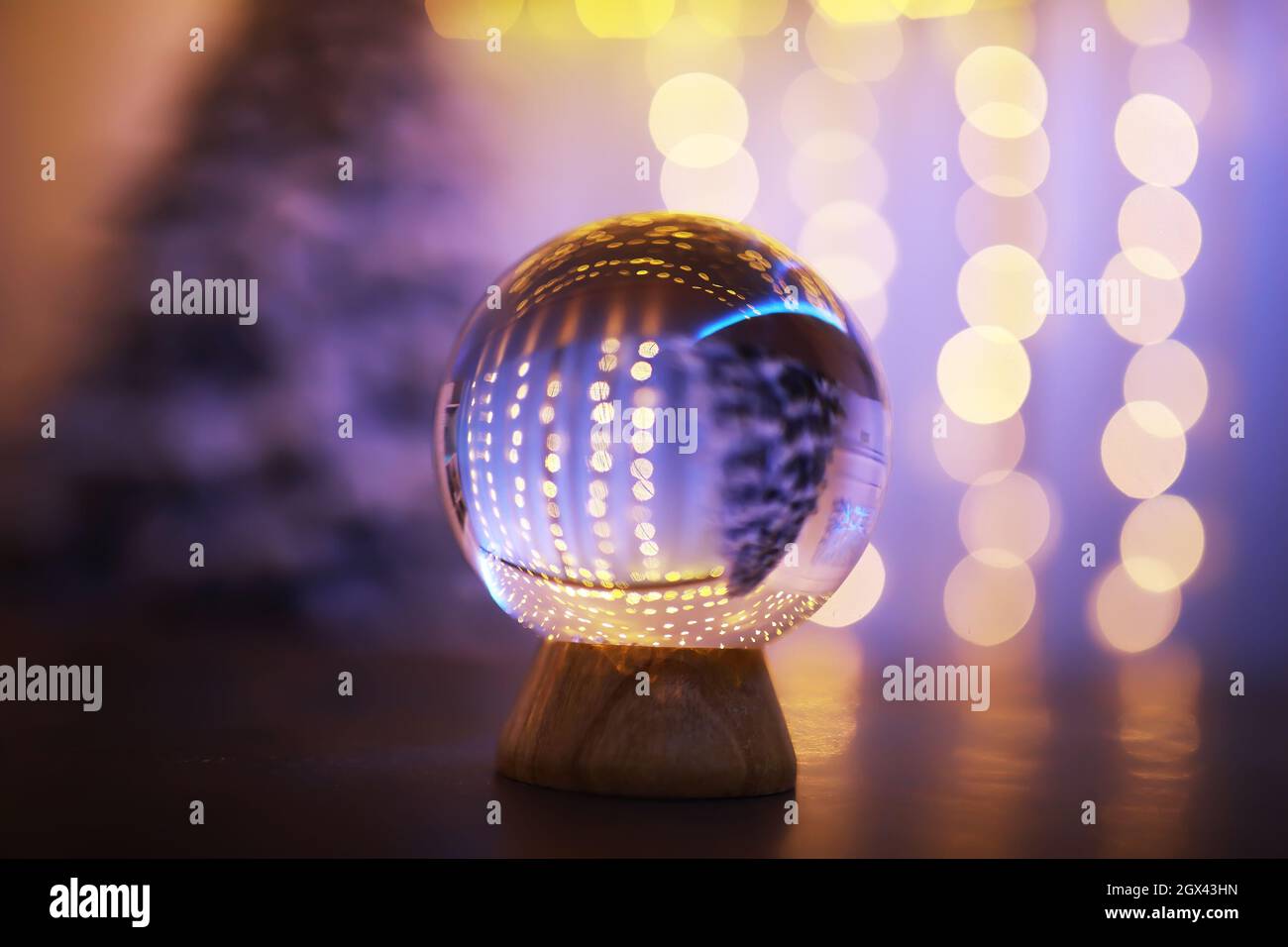 Crystal Ball on the floor with bokeh. Glass ball with colorful bokeh ...