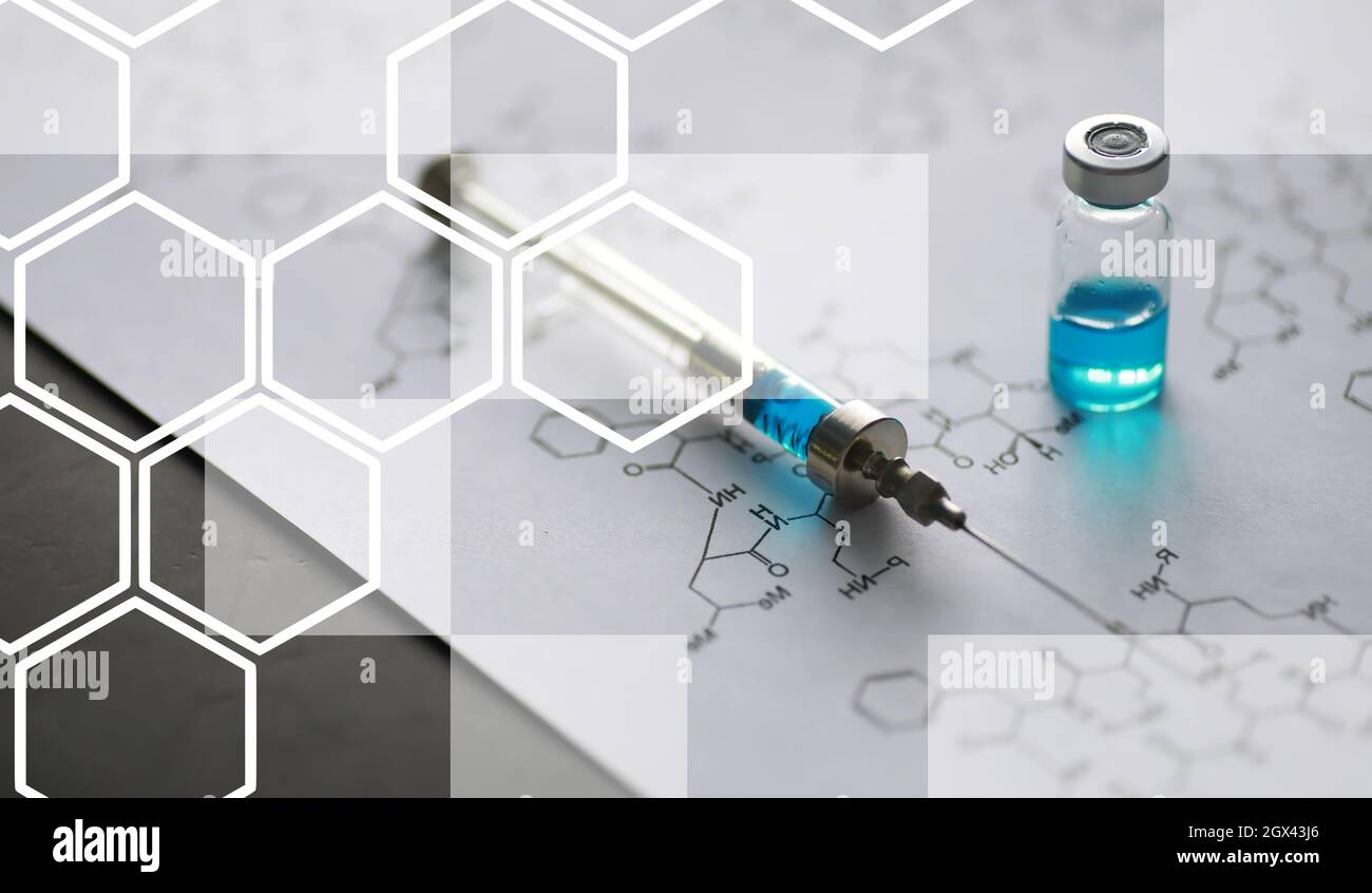 small jars with injection and syringe for injection on blue background ...